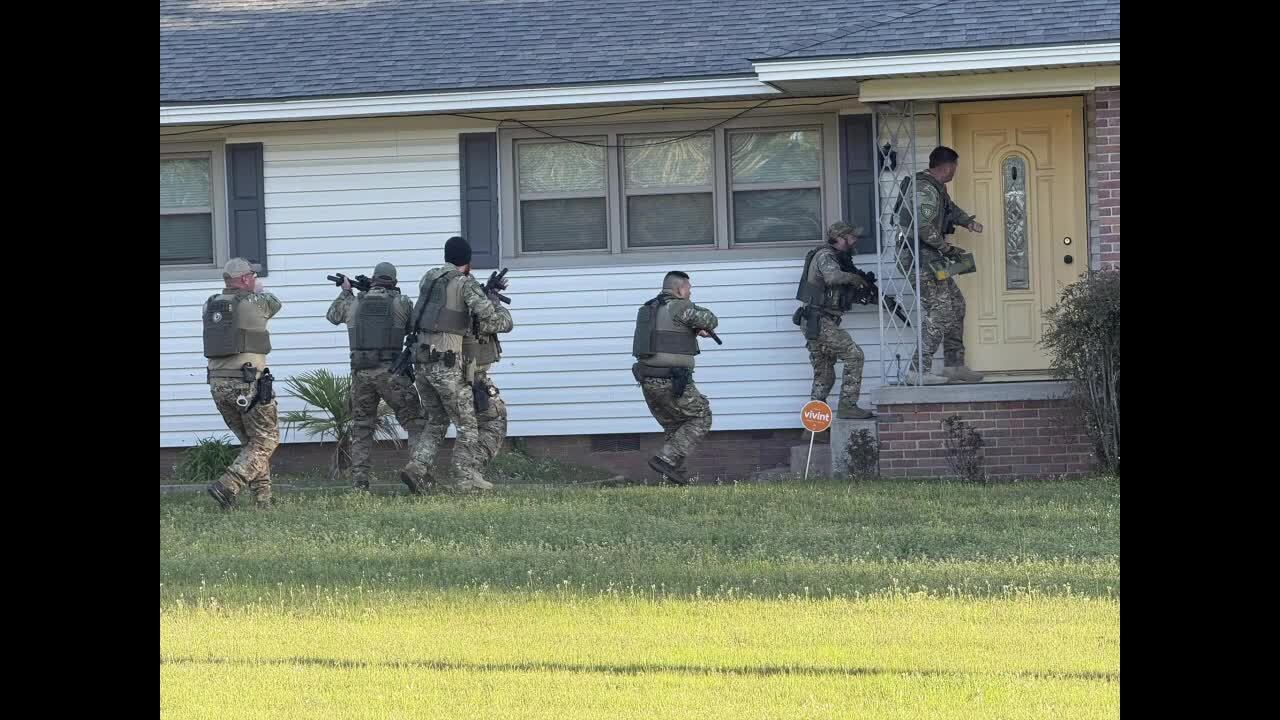 Marshall man arrested after raid finds guns, drugs, cash