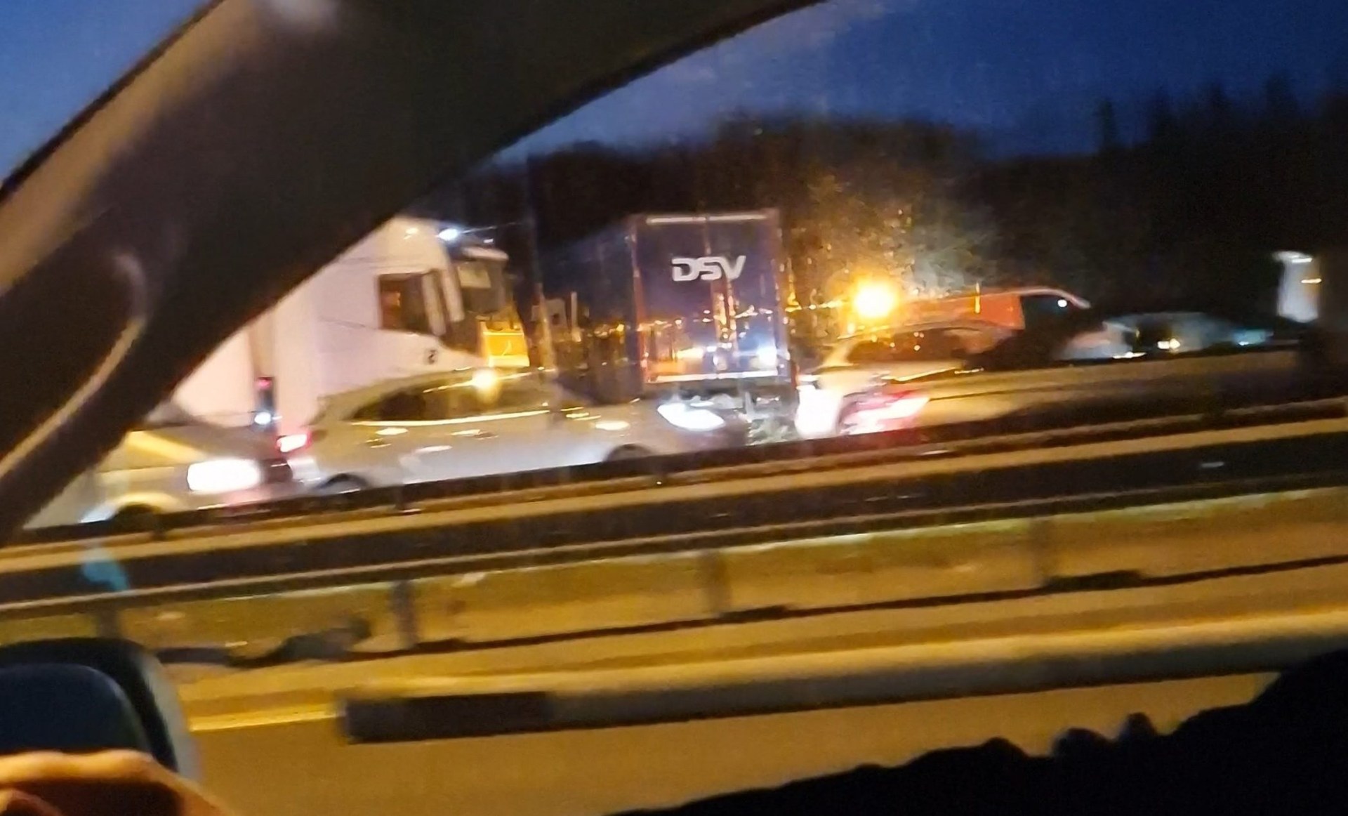 Several injured after lorry smashes through motorway reservation into ...