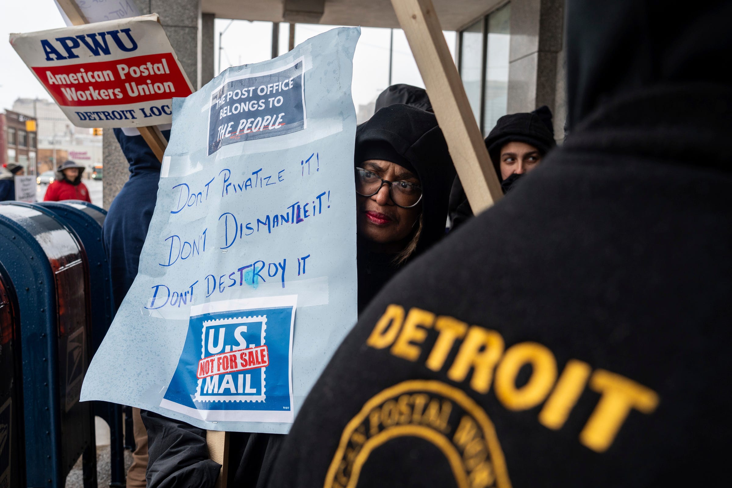 Postal workers protest in Detroit against potential takeover by Trump ...