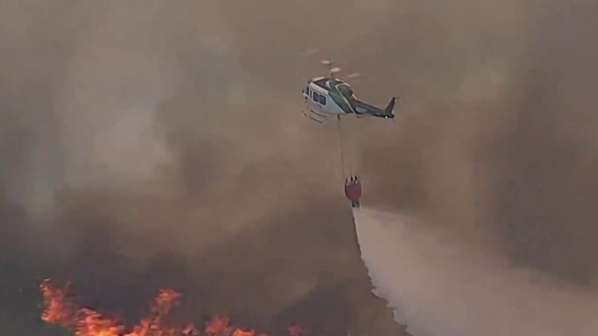 Wildfire burns for fourth day as winds shift and more crews join in ...