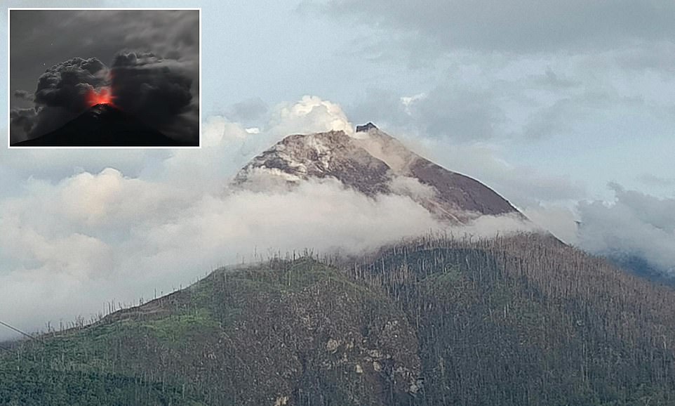 Indonesia volcano erupts sending 26,000ft tower of ash into the sky