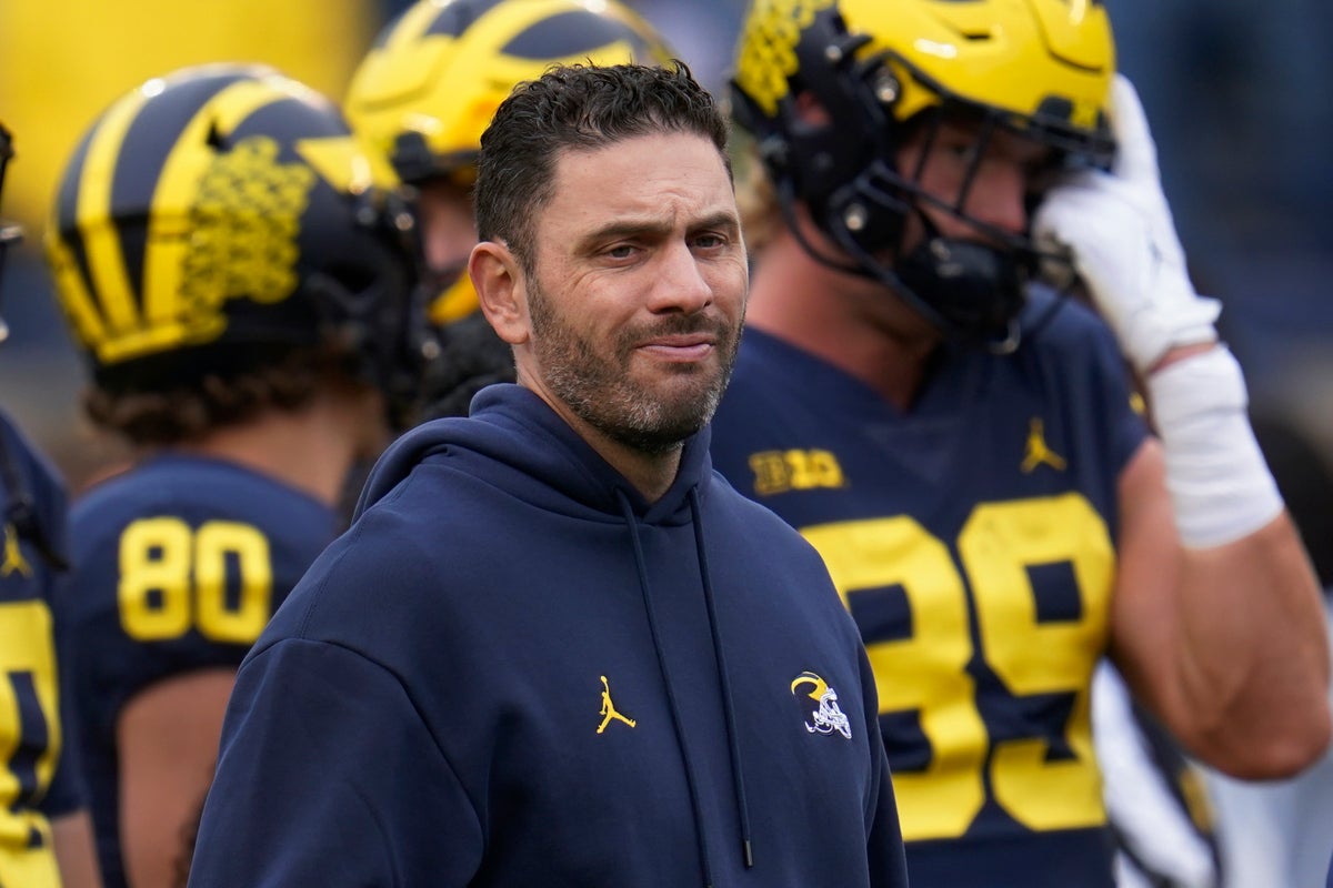 Former Michigan college football coach charged with hacking accounts ...