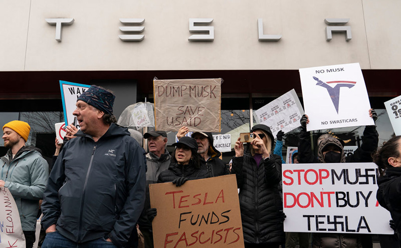 Man drives into Tesla protesters at dealership: Police