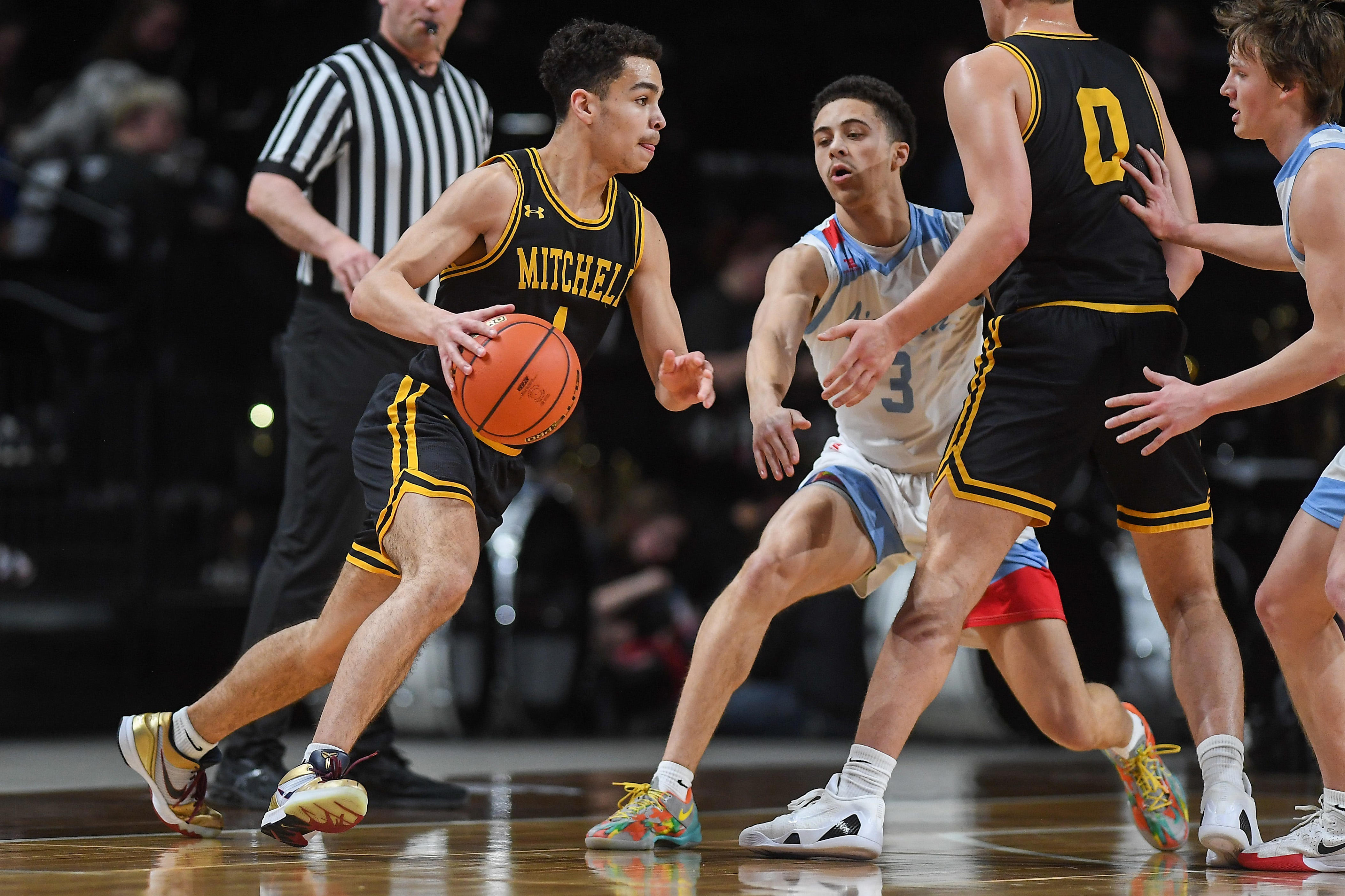 Mitchell defeats Lincoln, advances to South Dakota boys basketball ...