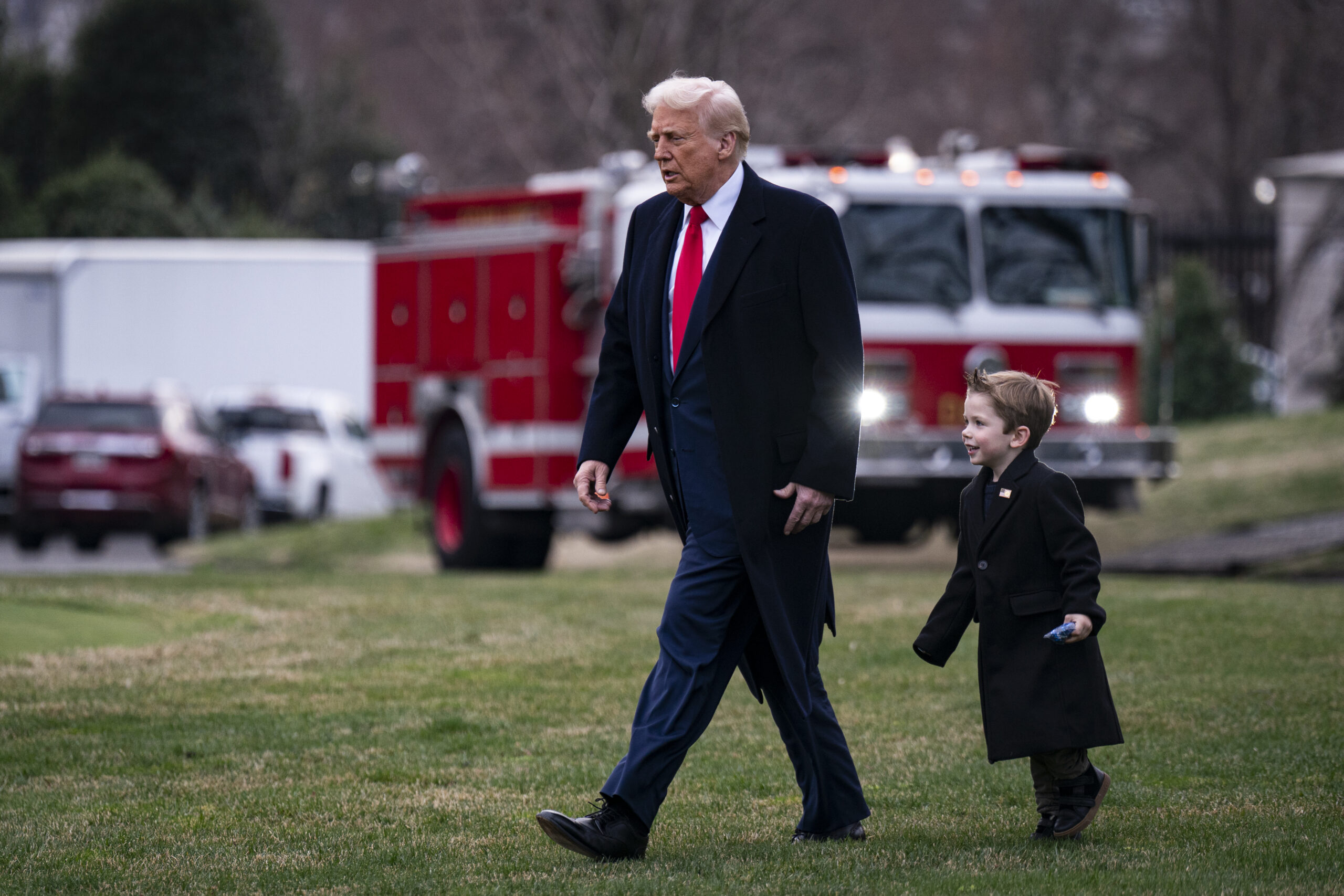 Trump and Elon Musk’s son walk to Marine One