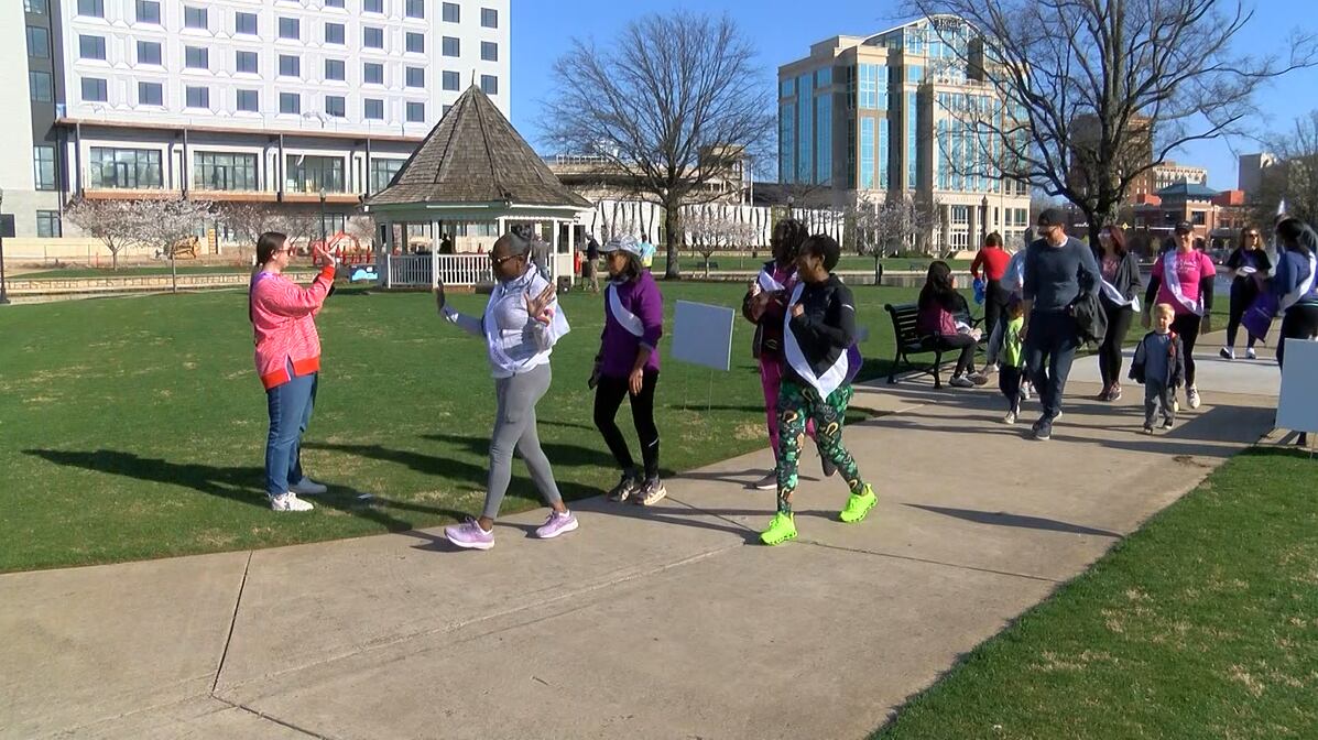 Women walked at Big Spring Park to celebrate Women’s History Month