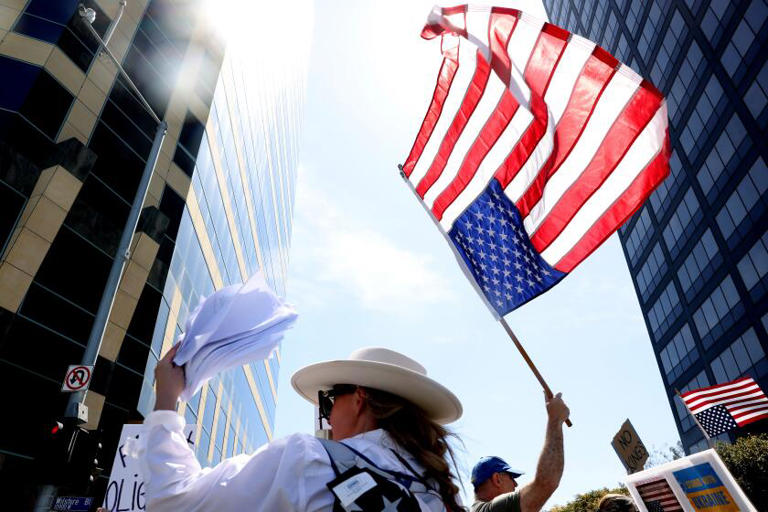 Hundreds rally in Westwood to protest Trump, Musk's government cuts ...