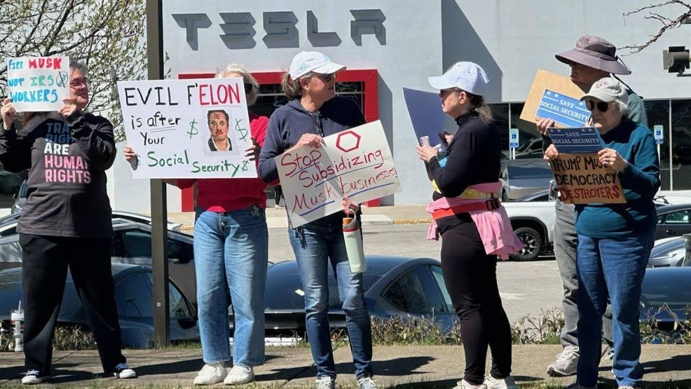 Protesters rally against Elon Musk outside Franklin Tesla dealership