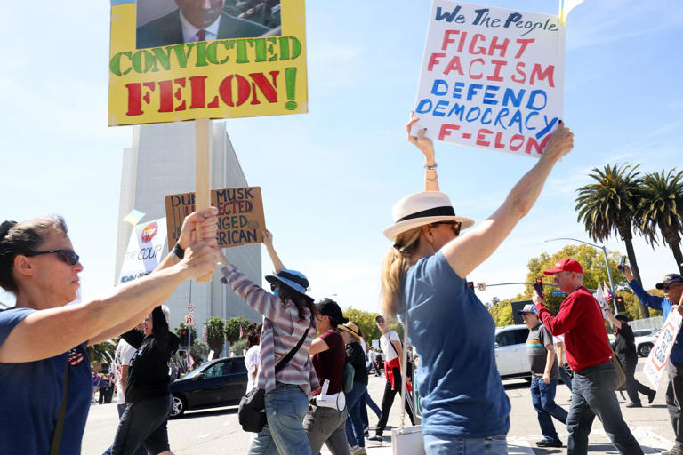 Hundreds rally in Westwood to protest Trump, Musk's government cuts ...