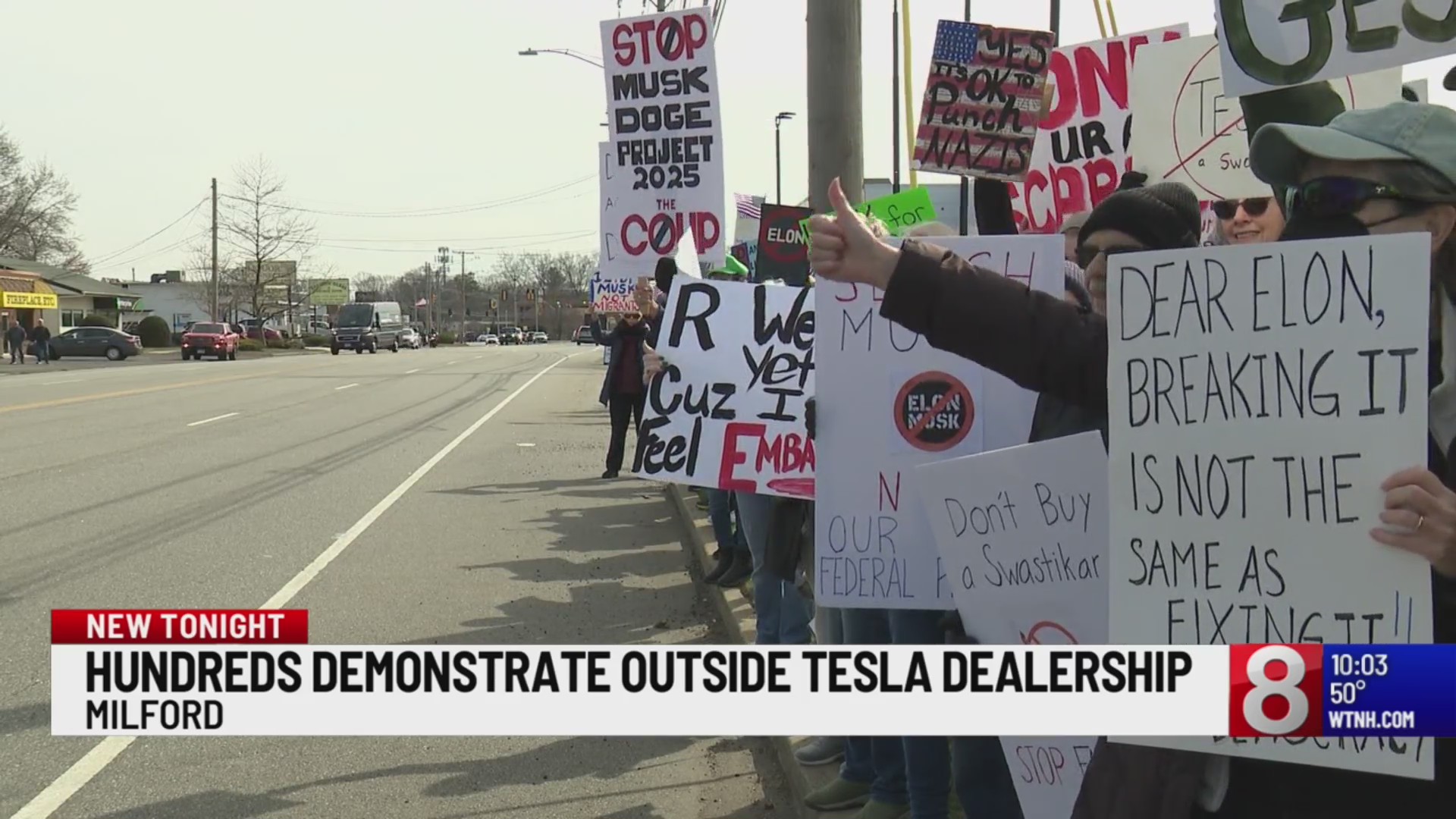 Hundreds protest outside Tesla dealership in Milford