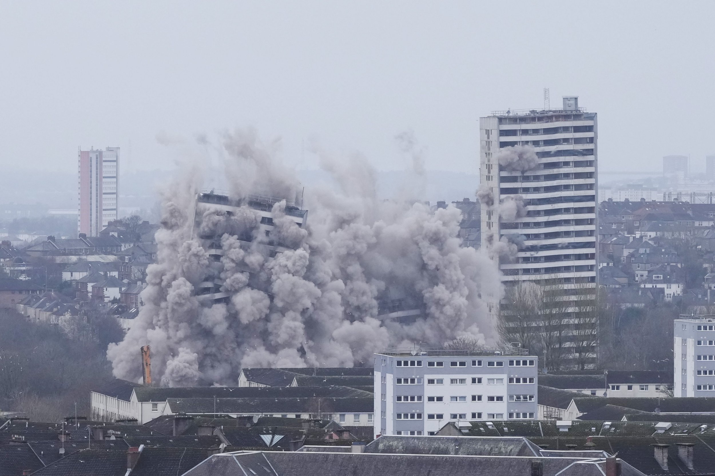 Three 26-storey tower blocks vanish in seconds after they're demolished ...