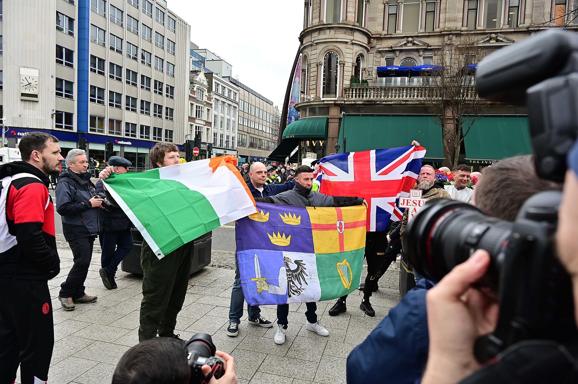Clashing Belfast protests go off without violence, as anti-racist side ...
