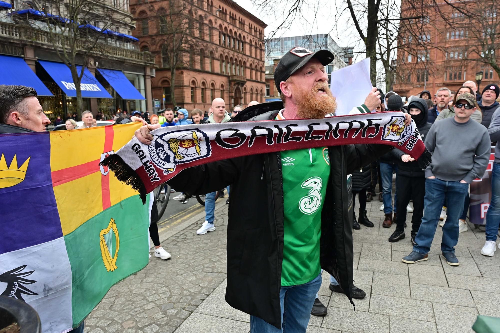 Clashing Belfast protests go off without violence, as anti-racist side ...