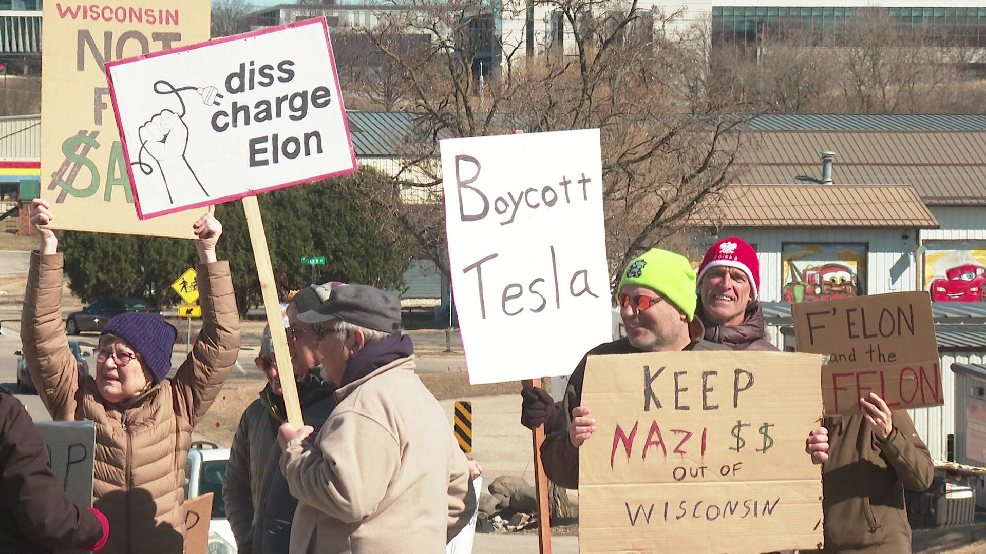 Protesters oppose Elon Musk, rallying outside Madison Tesla dealership
