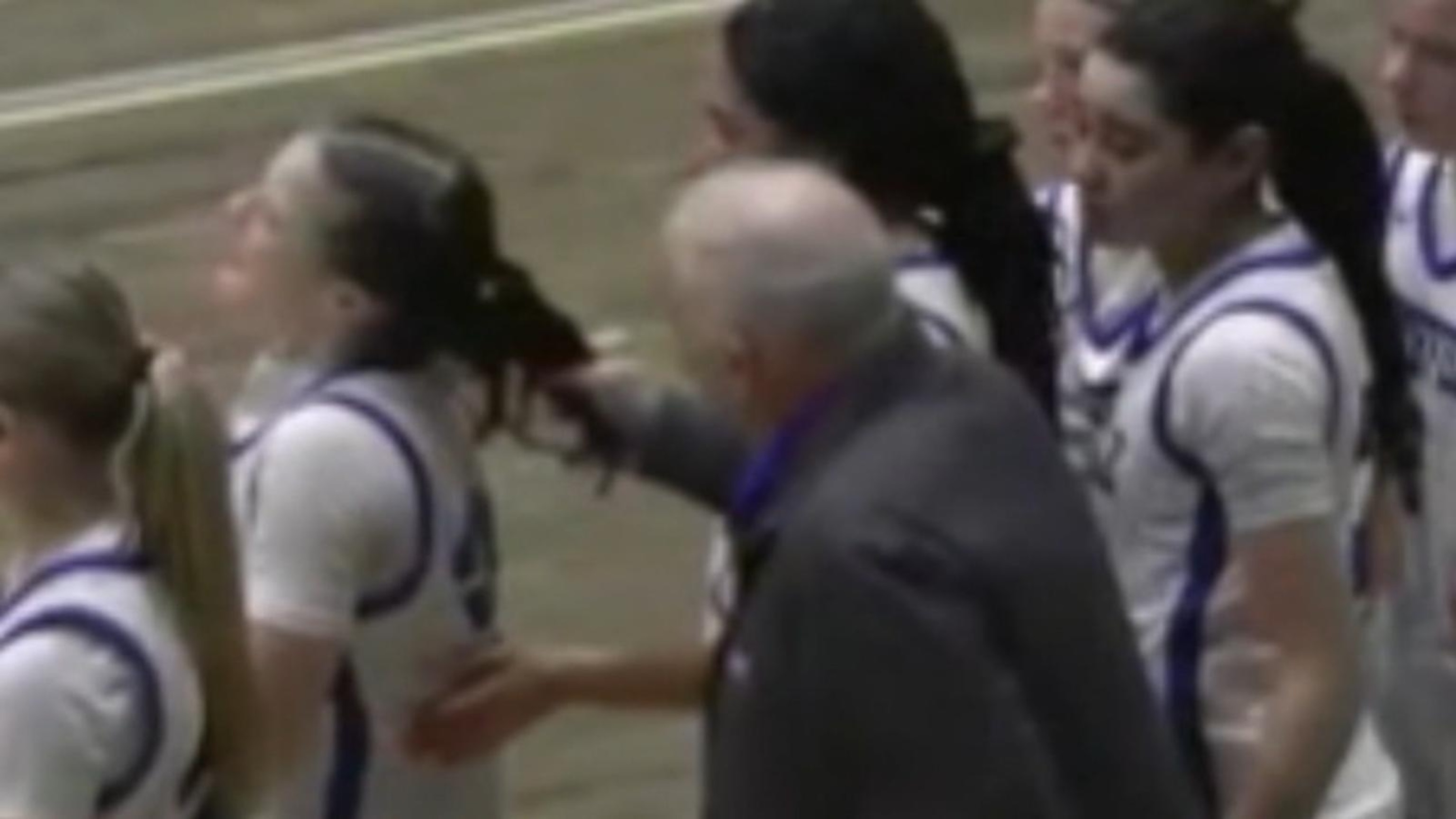 Coach fired for pulling player's ponytail