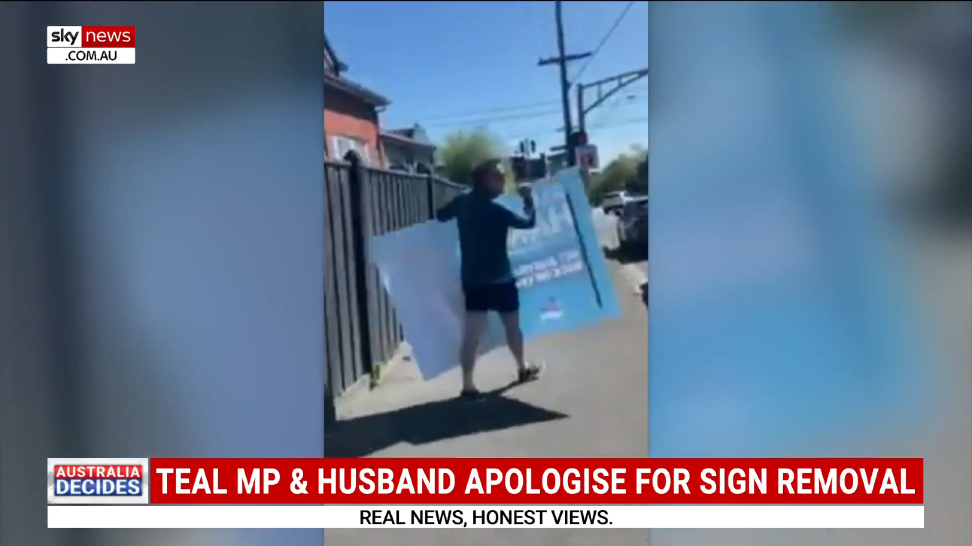 Teal MP Monique Ryan apologises for husband seizing Liberal rival's sign