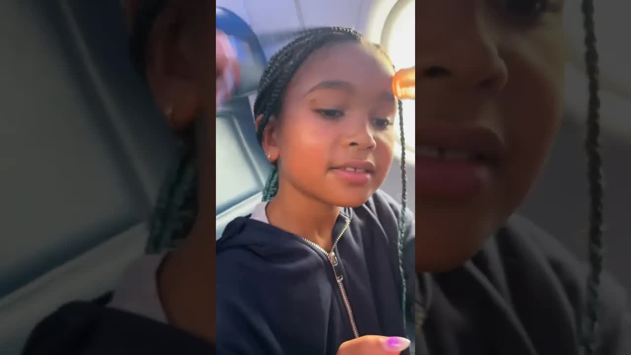 Child Tries Glitter Lip Gloss on Airplane
