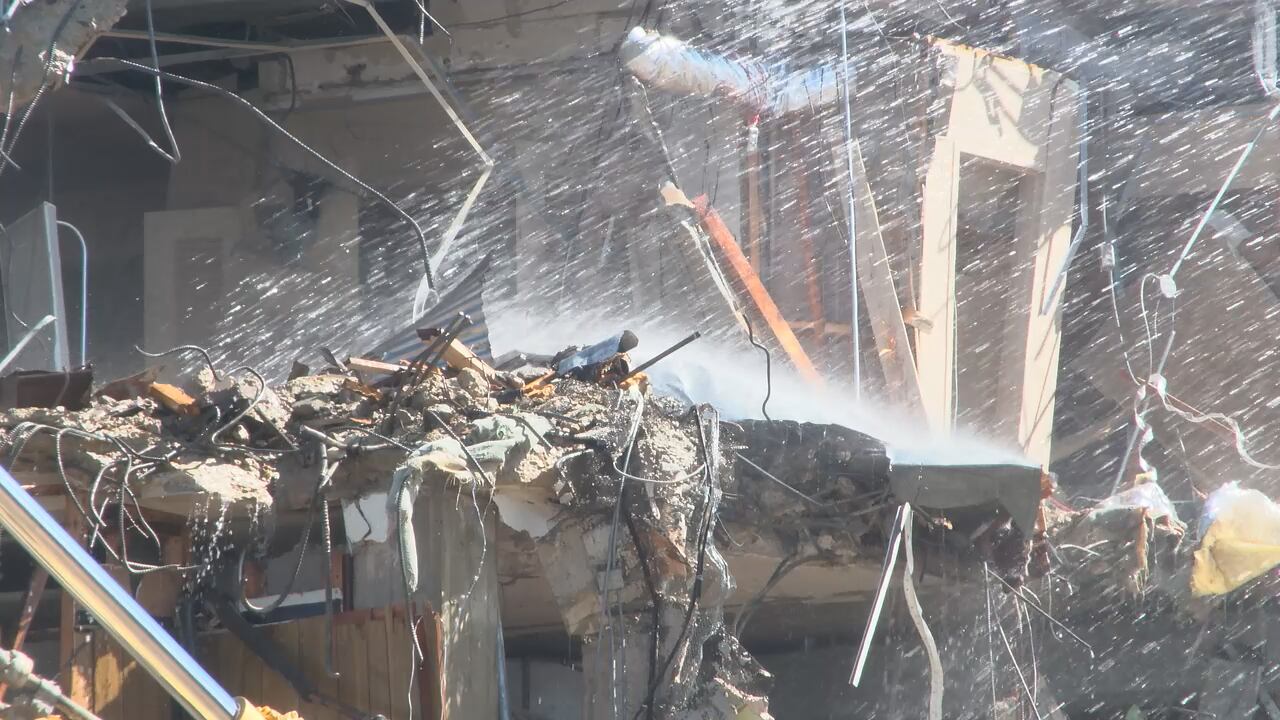 Demolition crews work to keep asbestos out of air