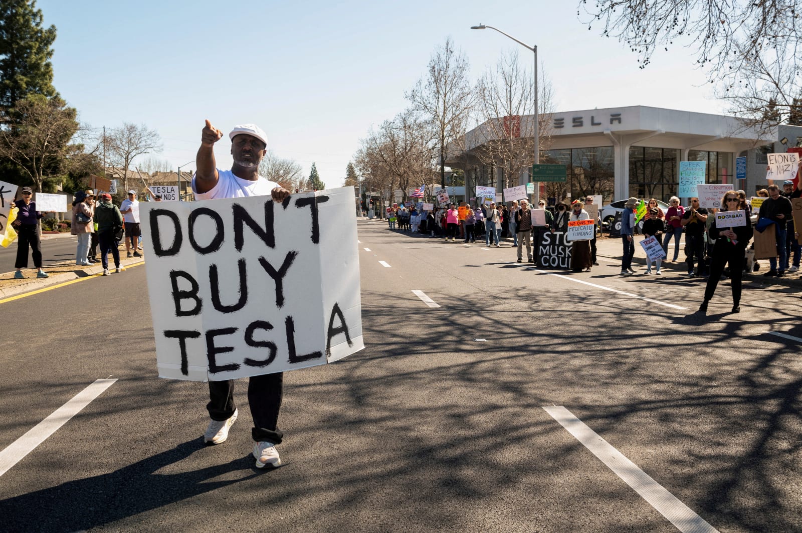 Man accused of driving car at anti-Tesla demonstrators arrested in Florida