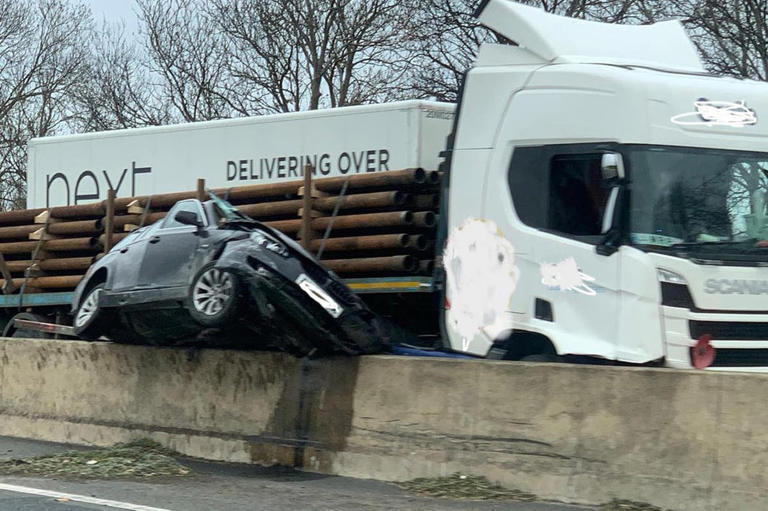 Car dragged 100 metres down central reservation but only minor injuries ...