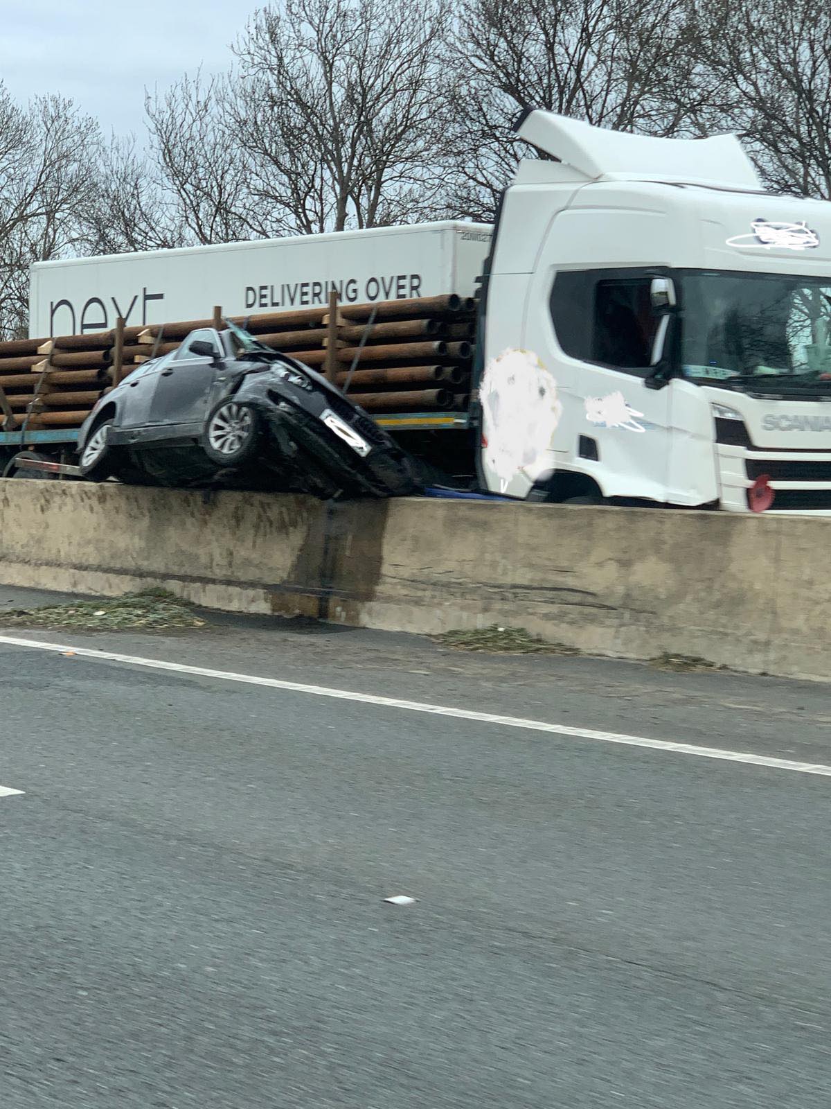 A1M crash: Car dragged 100 metres down central barrier by HGV after ...