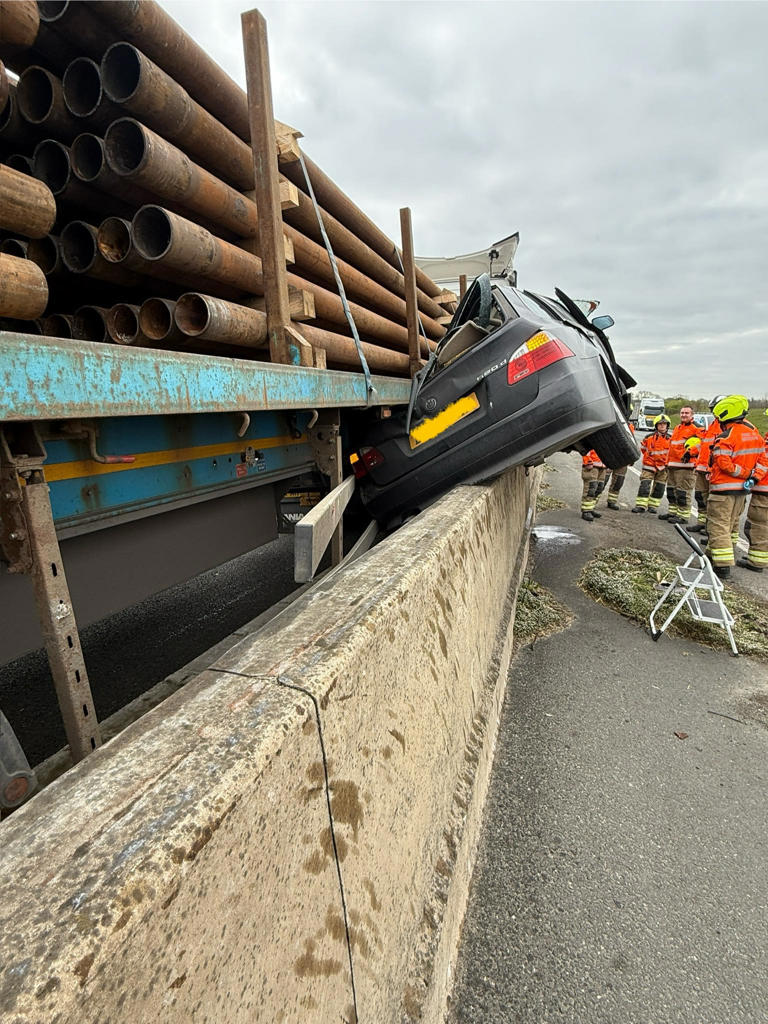 A1M crash: Car dragged 100 metres down central barrier by HGV after ...