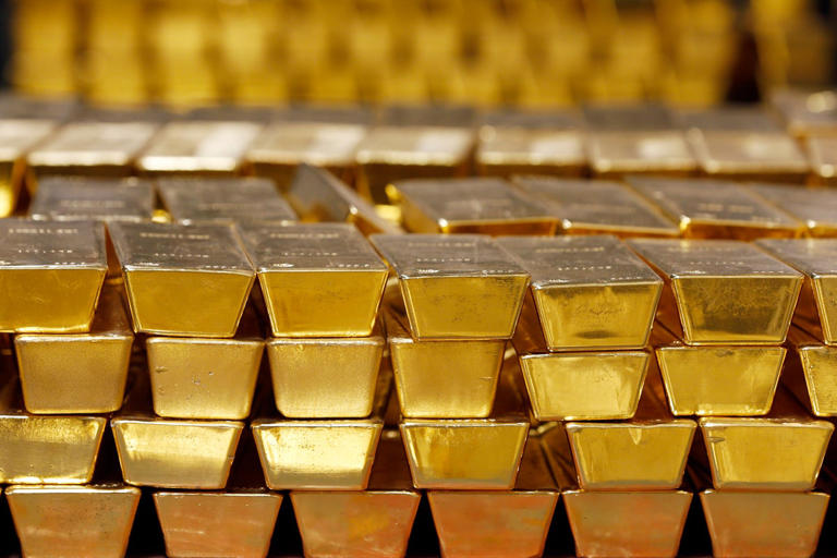 Gold rises to another record as anxiety grips markets. Here's what you ...