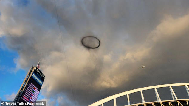 Mysterious black ring is spotted hovering in skies above Seattle