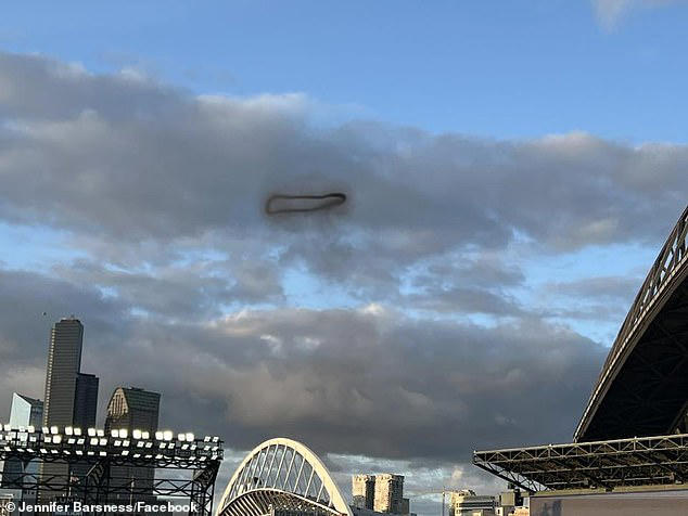 Mysterious black ring is spotted hovering in skies above Seattle