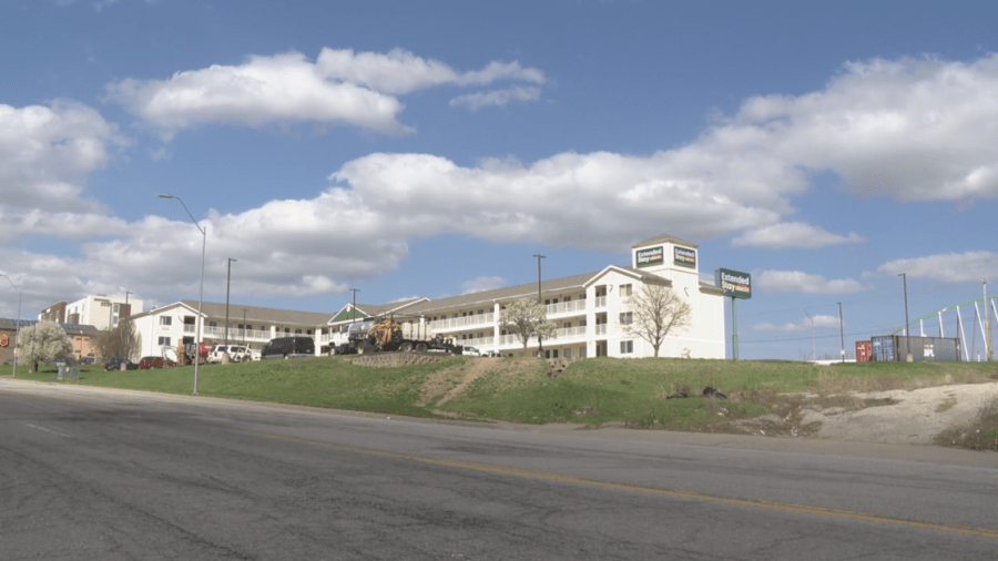 Man charged with killing parents at Kansas City motel