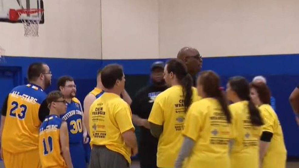 Community basketball game unites athletes and employees