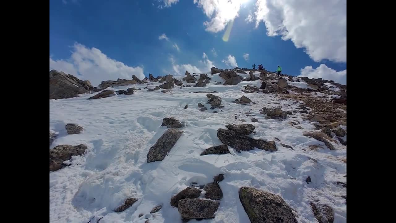 Terrifying moment mountaineer dodges huge falling rock with timely leap