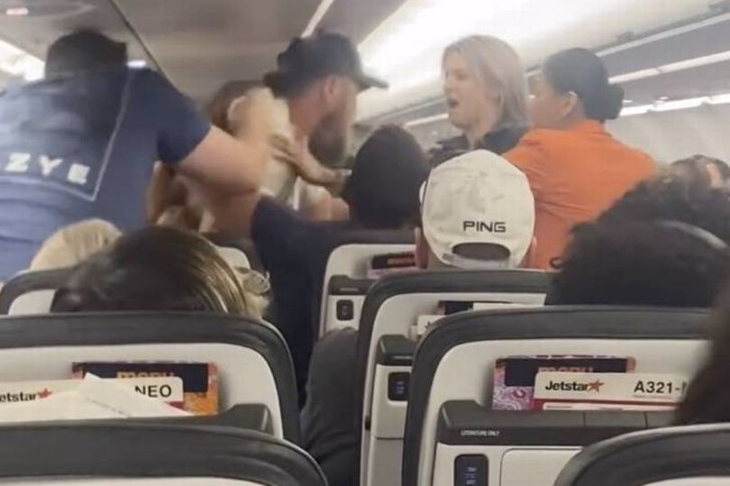 Plane passengers fight in mid-air brawl as argument over reclining seat ...