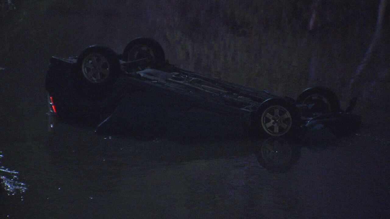 Three young men rescue two women from submerged vehicle