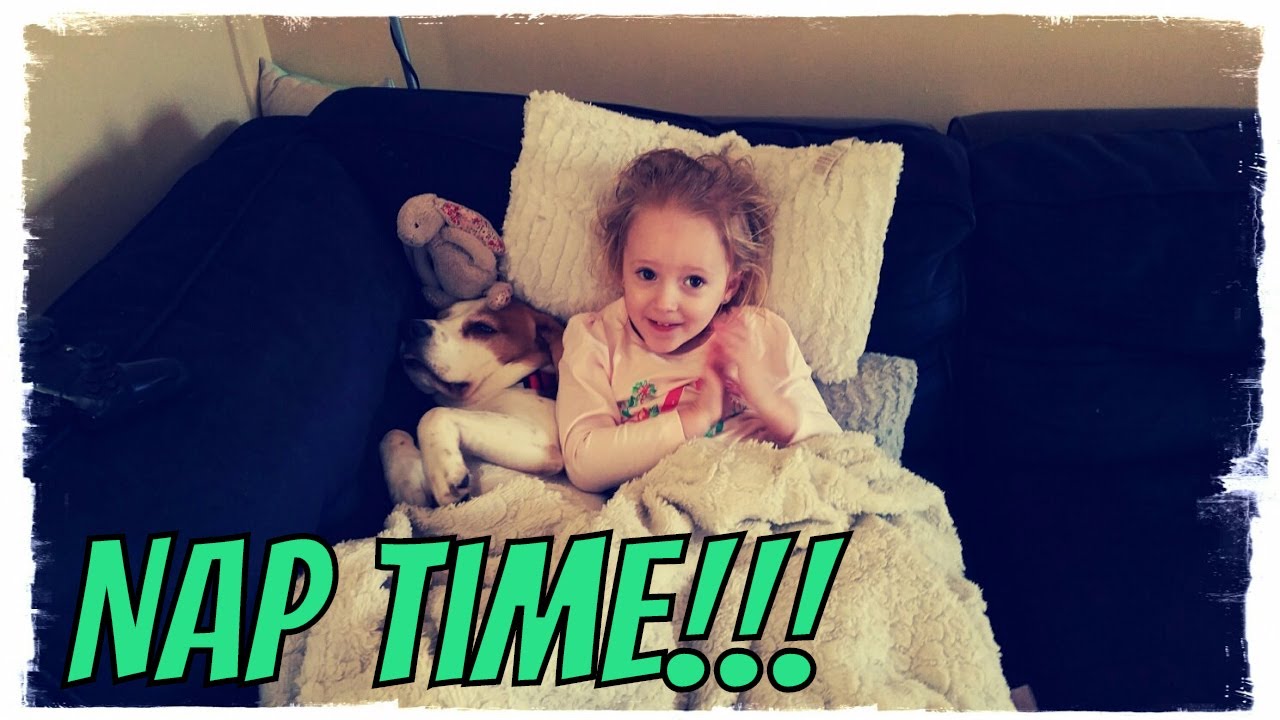 Girl Tucks Her Dog in for a Cozy Nap