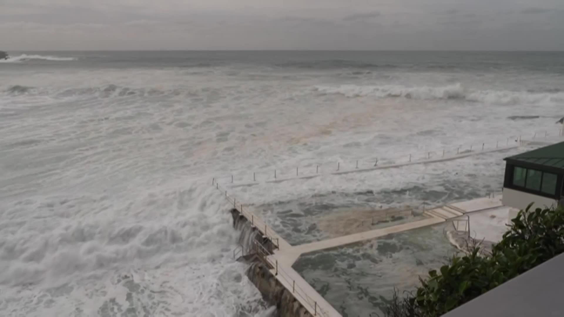 Parts of Sydney inundated by tidal surge causing minor damage