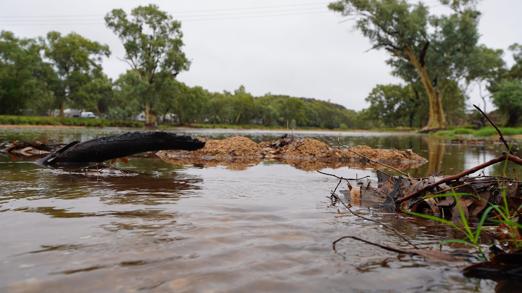 Uluru waterfalls flow, roads blocked as heavy rain hits Central Australia