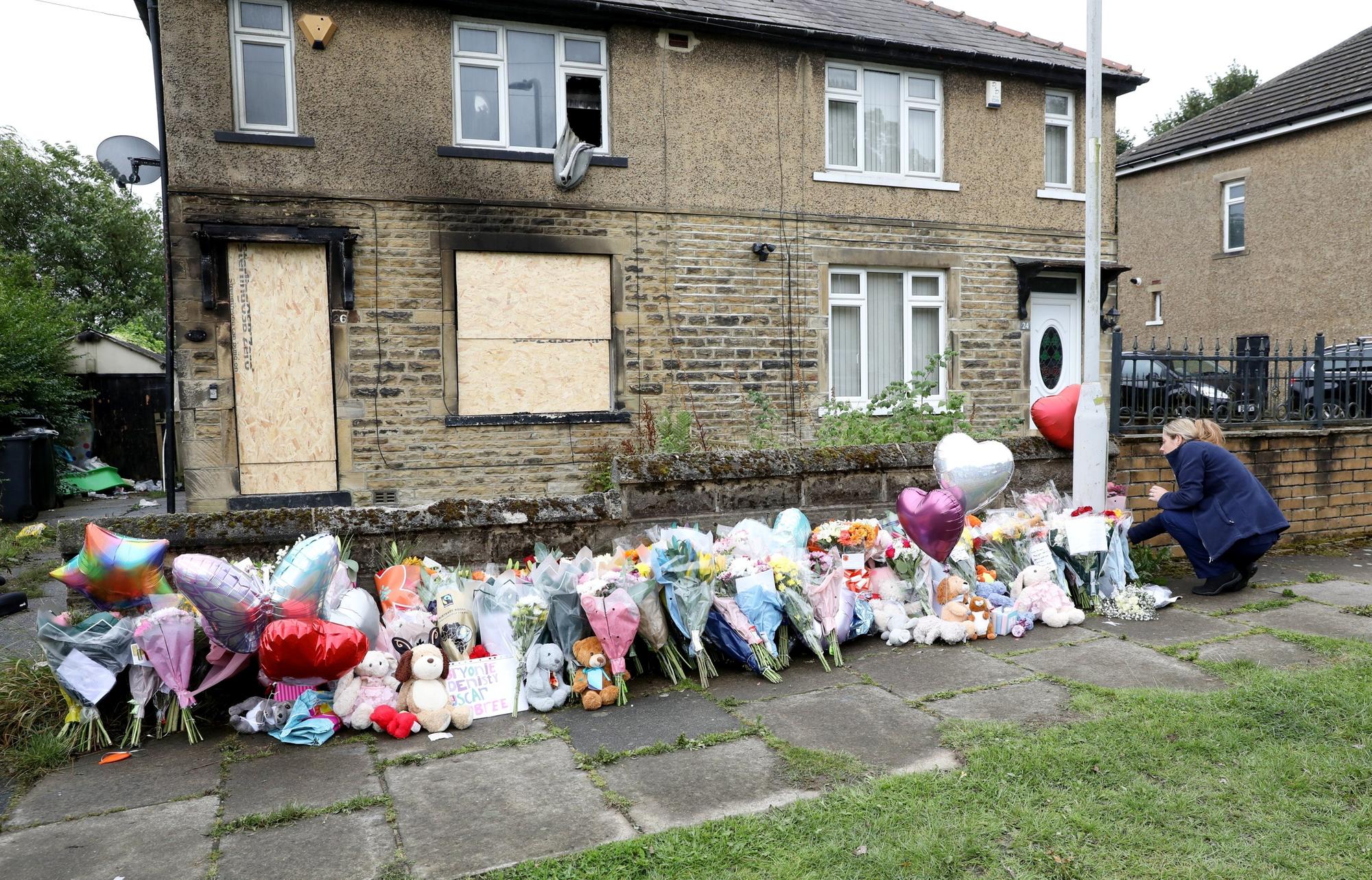 Murderer jailed for life over house fire which killed woman and three ...