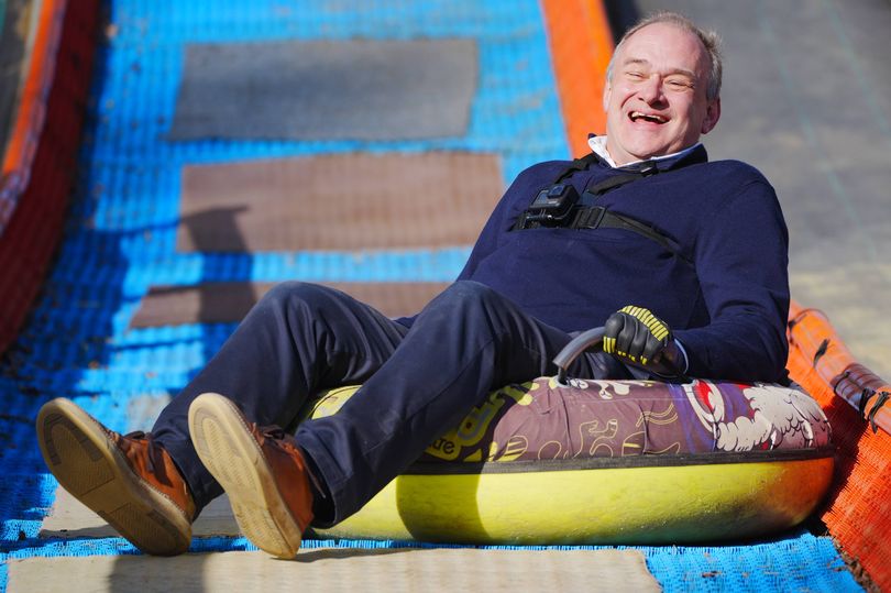 Ed Davey rides rubber ring to highlight Gloucestershire pothole problem
