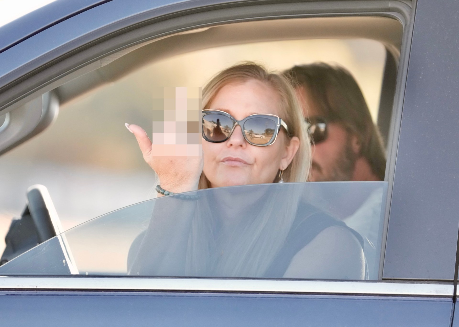 Virginia Giuffre gives the finger after being seen for first time since ...