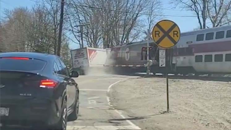 Video shows moment train slams into tractor trailer truck
