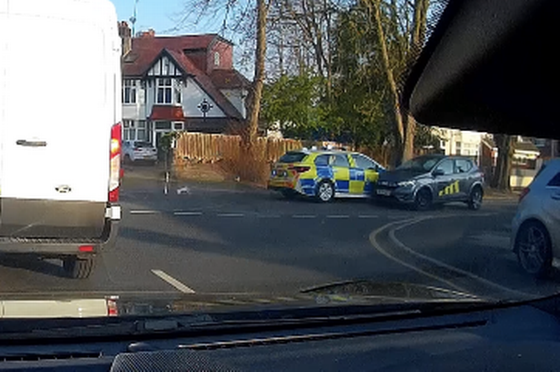 Moment police car crashes while responding to 999 call