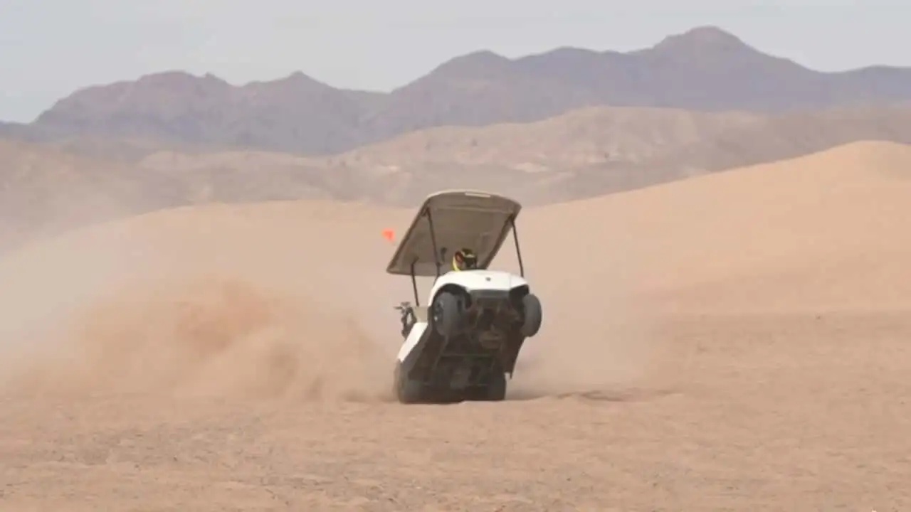 Golf cart modified by the Cboys takes on the dunes with 80 horsepower
