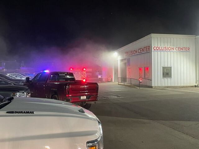 Topeka firefighter injured in late-night blaze at car dealership