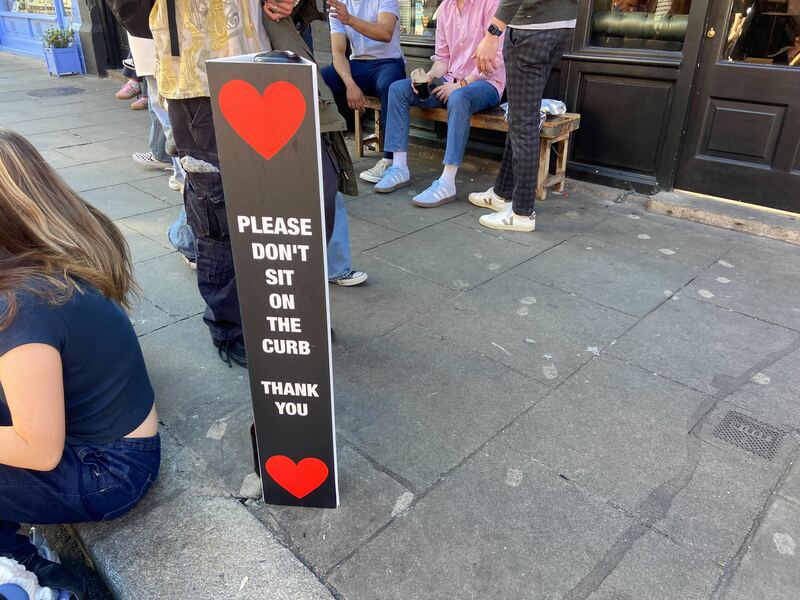 'Please don't sit on the curb' signs appear on Dublin's Drury Street