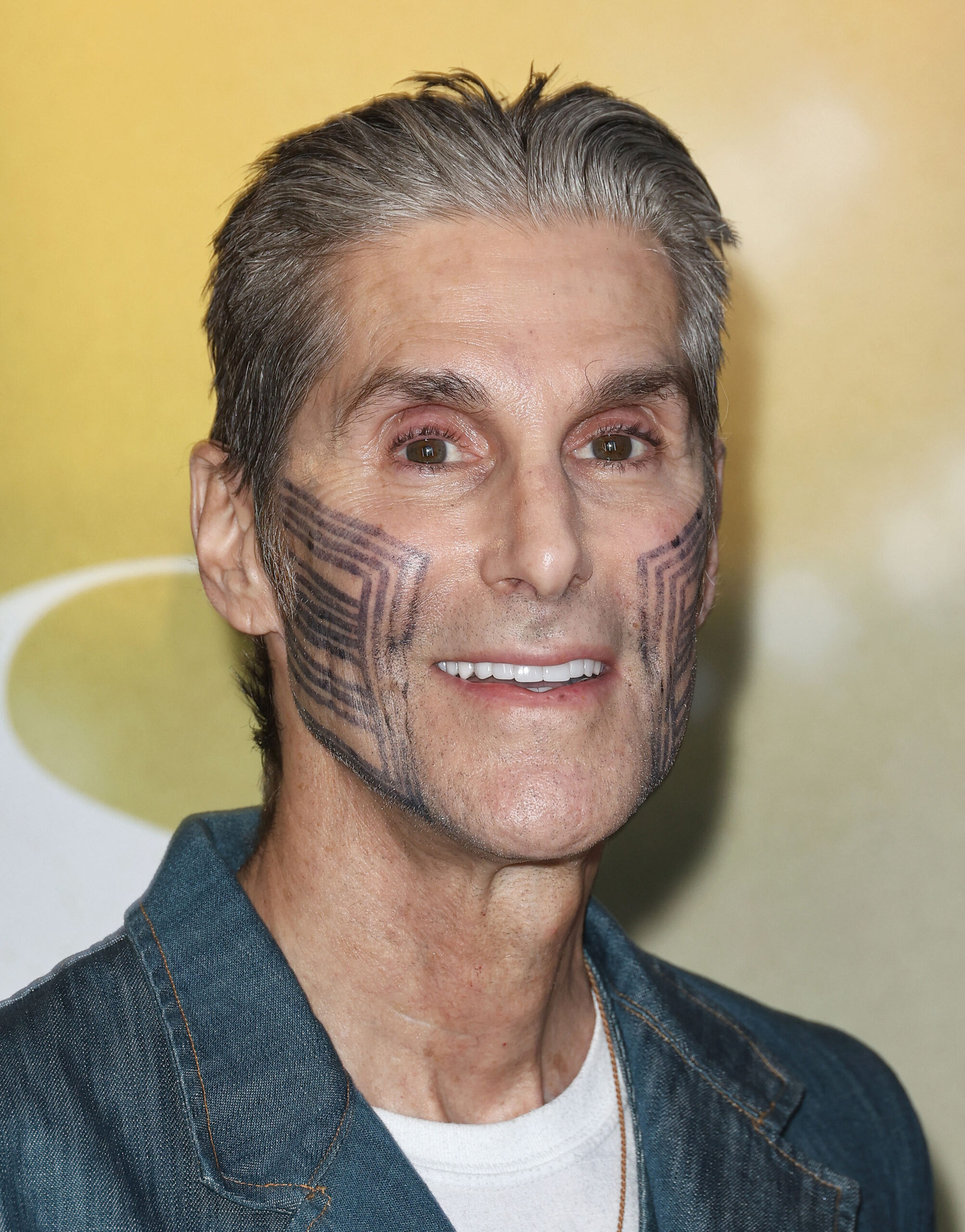 Iconic Rocker Debuts Cheek-Spanning Tattoos, More Stars With Face Tats