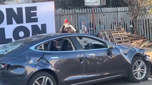 Tesla smashed to pieces in London protest against Elon Musk