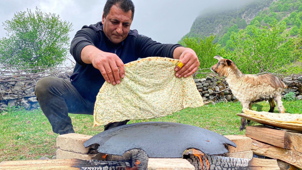 Making traditional kutab with fresh greens & fire
