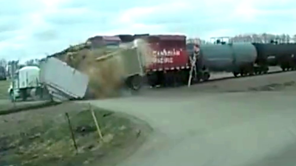 Train slams into semi-truck, splits it in half