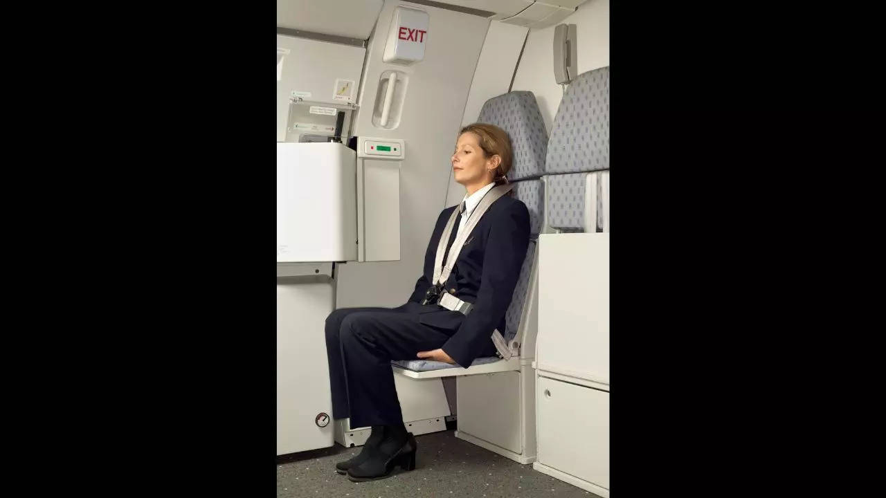 Ever wonder why flight attendants sit on their hands during takeoff and ...